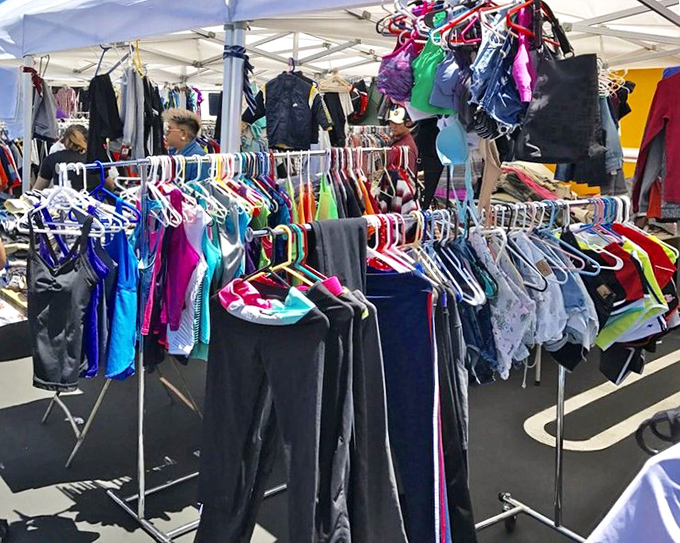 Racks of clothing flutter in the breeze like fabric flags. Fashion treasures hide among these hangers, waiting for someone with a keen eye.