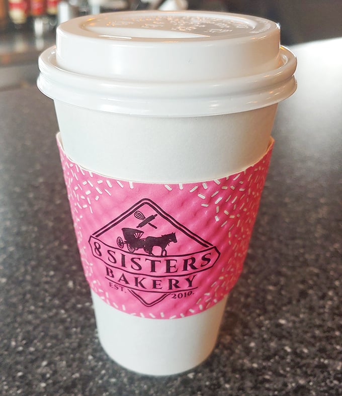 Their coffee cup doesn't just hold caffeine&mdash;it's a pink-wrapped promise that today might actually turn out okay after all.