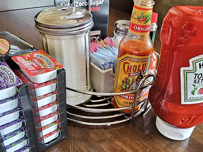 The condiment caddy&mdash;that unsung hero of breakfast customization where hot sauce dreams and ketchup fantasies come true for the discerning diner.
