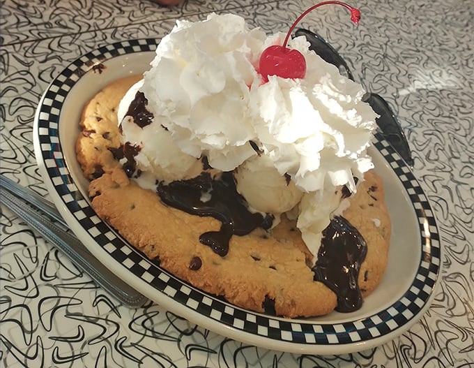 Cookie &agrave; la mode&mdash;where warm meets cold in dessert harmony. That whipped cream mountain needs its own climbing permit.