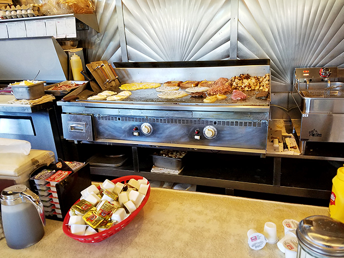 The flat-top grill, seasoned by thousands of breakfasts, holds more stories than a small-town librarian and twice as much sizzle.