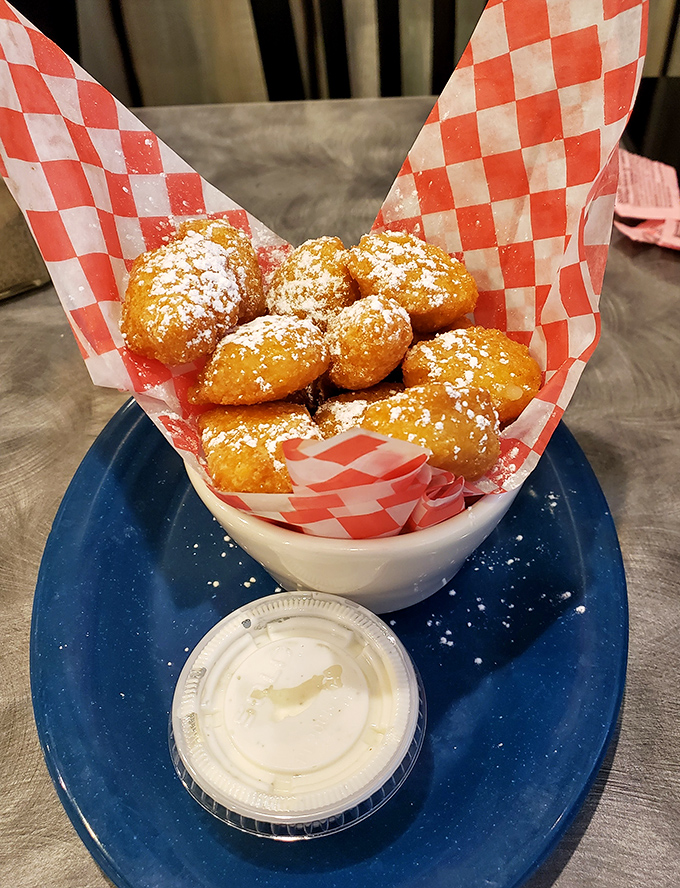 Golden corn nuggets dusted with powdered sugar create that perfect sweet-savory moment that makes you wonder why you haven't been eating these your whole life.