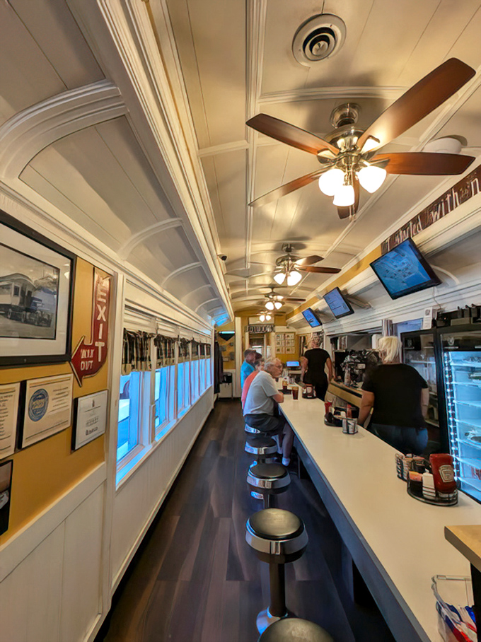 The classic diner counter offers front-row seats to watch breakfast magic happen in real time.