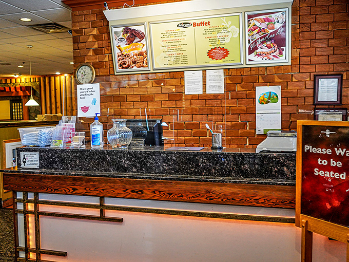 The host station&mdash;your gateway to abundance. That "Please Wait to be Seated" sign might as well say "Prepare Your Appetite."