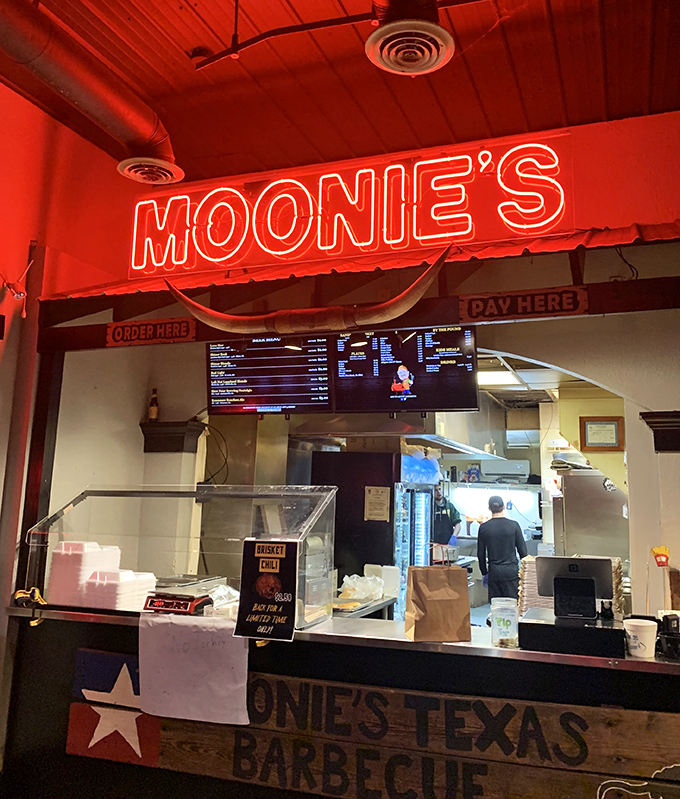 The neon glow of barbecue paradise. Moonies' ordering counter is where dreams are made and diets are forgotten.