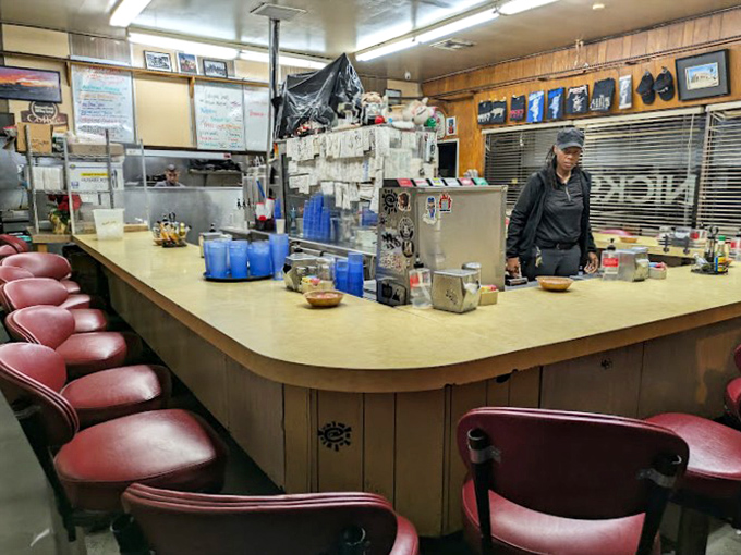 The curved counter with its worn wooden edge has witnessed countless first dates, business deals, and hungover Sunday recoveries.