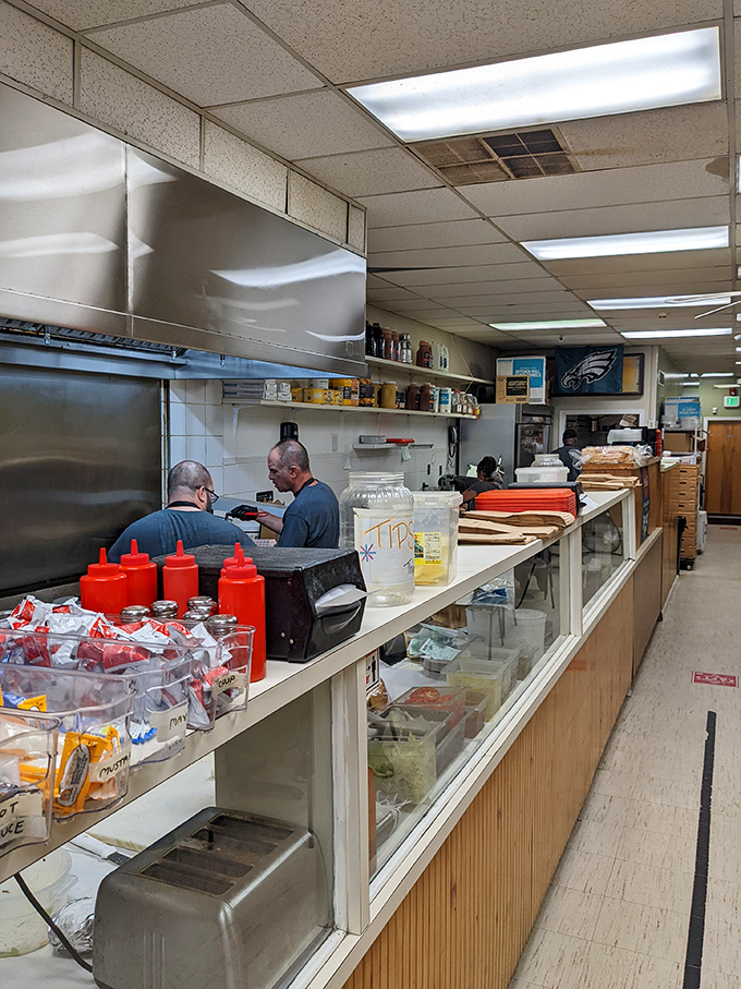 Where sandwich magic happens. Those red squeeze bottles aren't just condiment containers&mdash;they're flavor wands waiting to transform your meal.