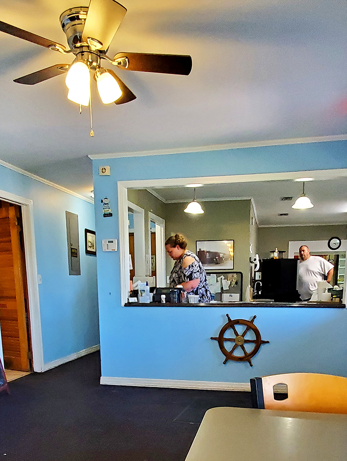 Where the magic happens &ndash; a glimpse into the kitchen pass, complete with a ship's wheel that reminds you exactly where your dinner came from.