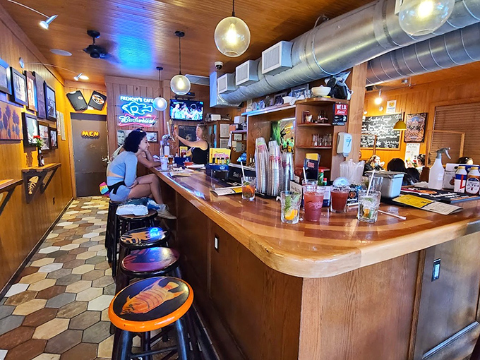 The bar at Frenchy's&mdash;where strangers become friends and friends become regulars. Wood-worn and wonderful, just as a beach bar should be.