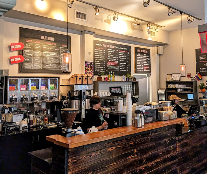 Behind this counter, baristas perform the sacred ritual of turning beans into liquid motivation with the precision of symphony conductors.