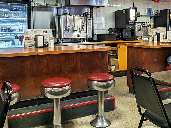 Classic counter seating where regulars have been solving the world's problems over coffee for decades. Those red stools have heard it all.