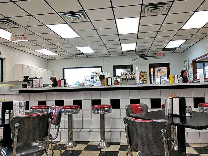 Counter seating—where strangers become temporary neighbors united by the universal language of "pass the ketchup, please."