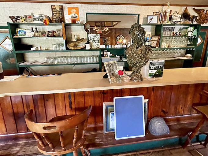 The bar area &ndash; where glasses gleam, wood paneling glows, and conversations flow as freely as the beverages.