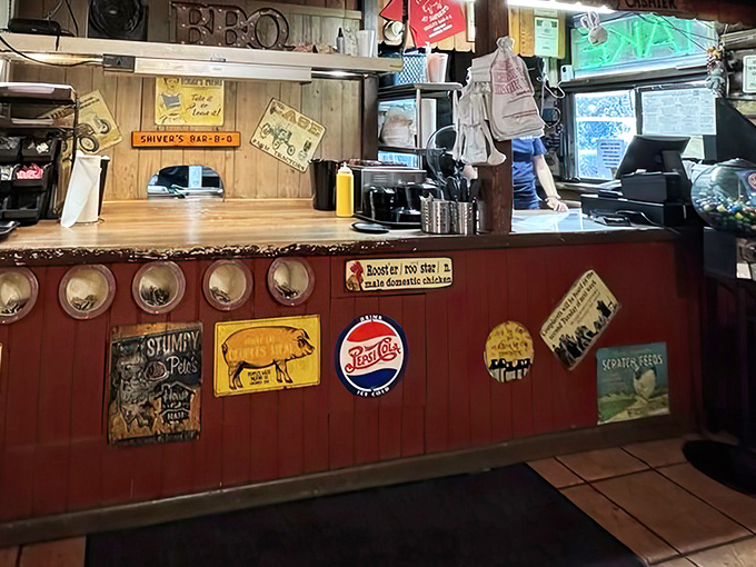 The counter area tells stories through vintage signs and well-worn wood. This is where barbecue dreams are ordered, then swiftly realized.