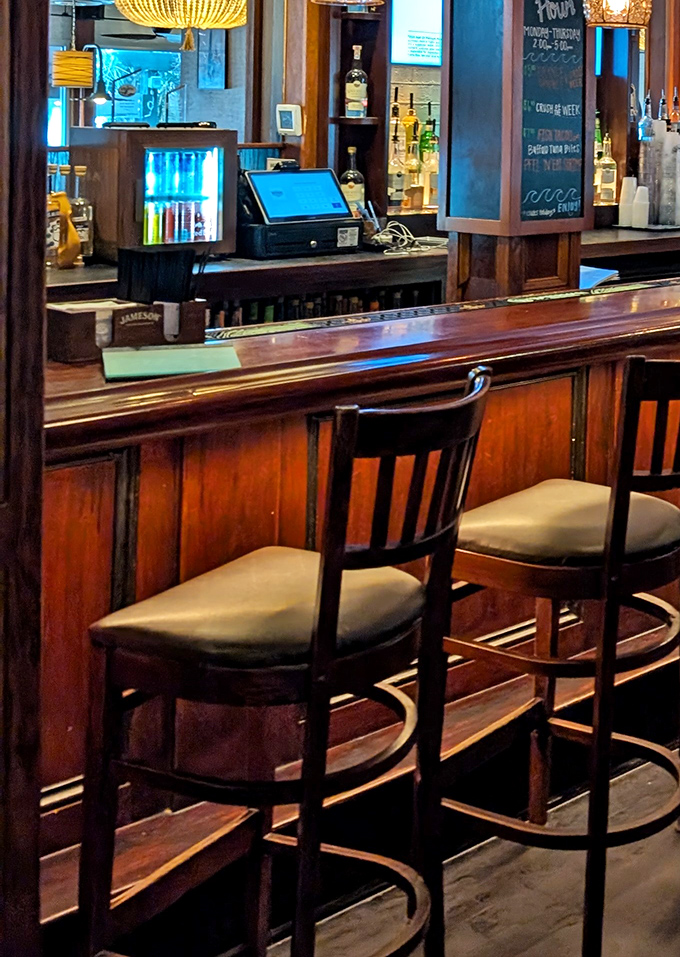 Rich wood tones and comfortable seating invite you to linger at the bar, where Orange Crushes flow and seafood dreams begin.