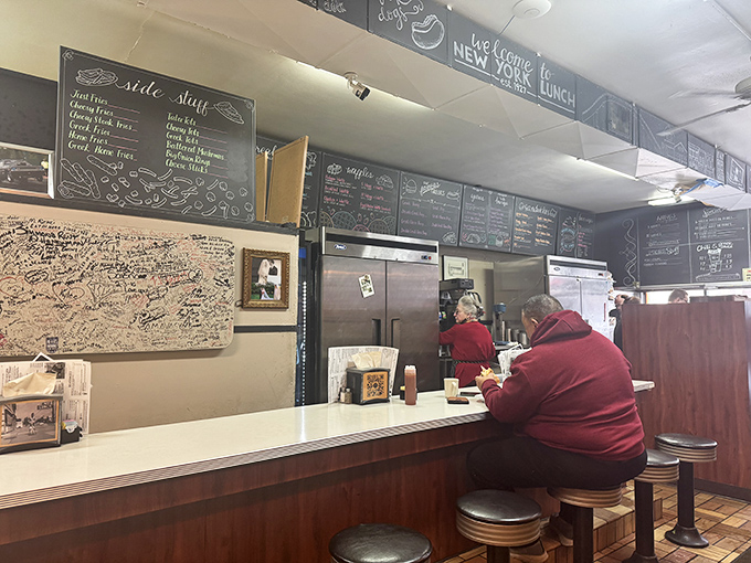 Counter seating: where solo diners find community and everyone gets a front-row view of short-order magic in action.