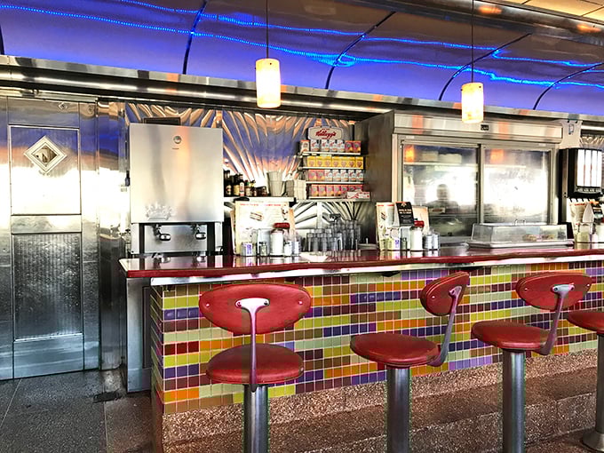 The counter's colorful tile work and retro stools invite solo diners to perch where they can watch short-order magic happen in real time.