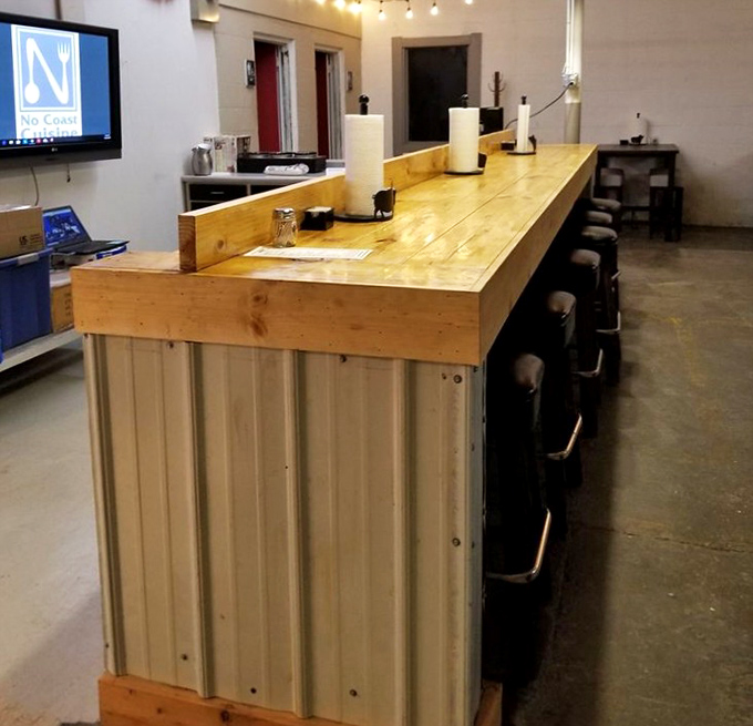 This bar seating area isn't just functional&mdash;it's where solo diners become barbecue philosophers, contemplating the meaning of perfect smoke rings.