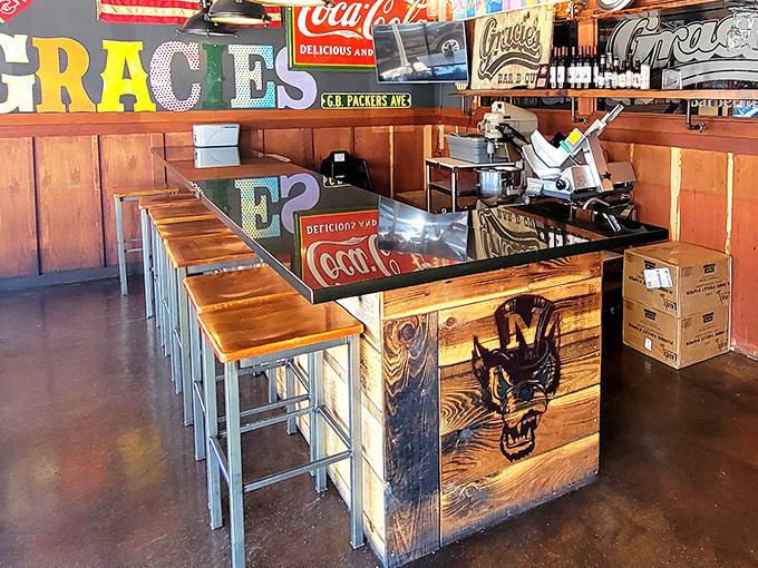 A counter that tells stories through its wood grain, with vintage Coca-Cola signs overhead. Pull up a stool and join the barbecue congregation.