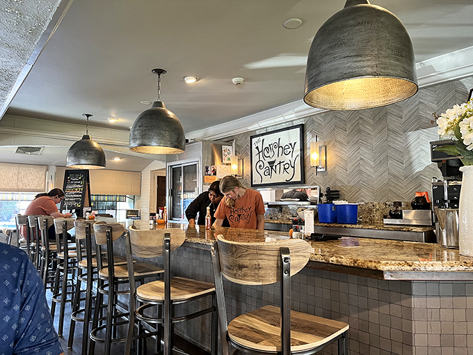 Counter seating offers front-row seats to the culinary theater where breakfast dreams become delicious reality daily.