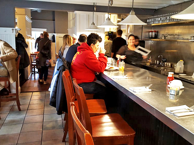 Where strangers become friends over shared maple syrup drizzles and coffee refills&mdash;the counter seating at its bustling best.