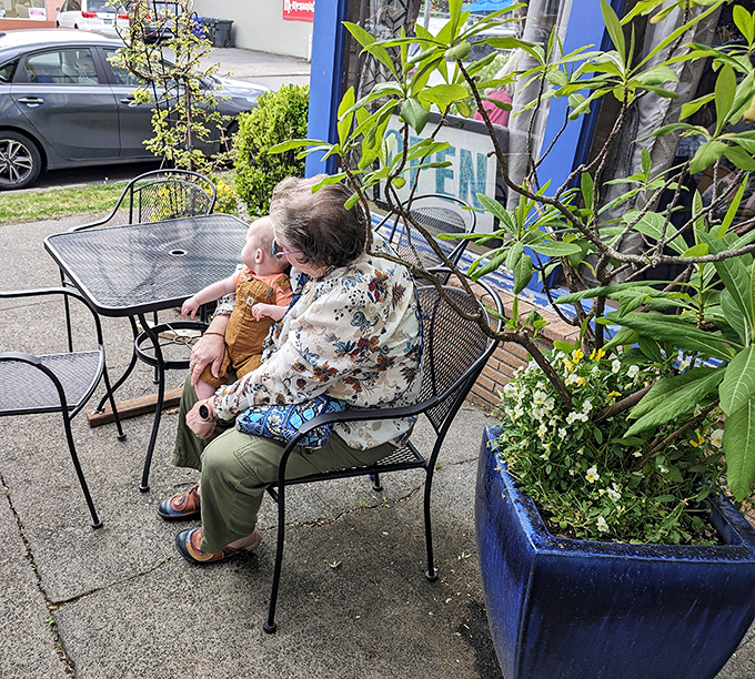 The outdoor seating area offers a peaceful retreat where generations connect over the universal language of really good food.