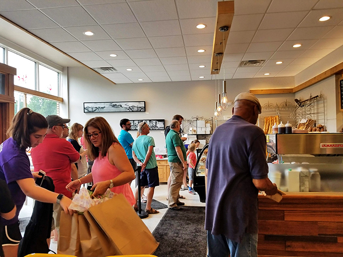 The line forms early and for good reason. These loyal customers know that patience is rewarded with bread that makes grocery store loaves seem like distant relatives.