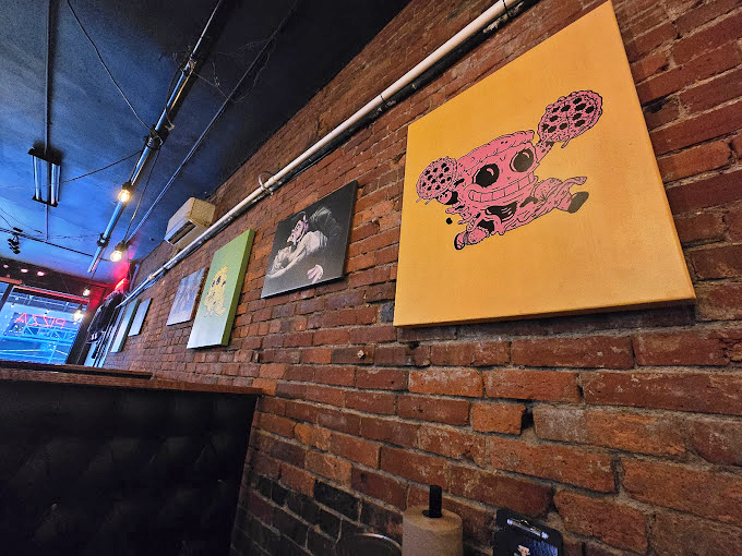 Vintage signs and quirky artwork add personality without overwhelming the space - decoration done exactly right here.