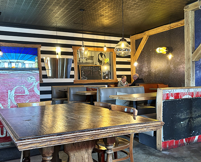 Black and white stripes meet starry walls in this dining area that feels like a British pub reimagined by a Hoosier with an artistic flair.