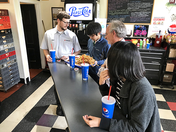 Pepsi in hand and anticipation on their faces, these diners are about to experience what locals call "the best lunch money can buy in Ohio."