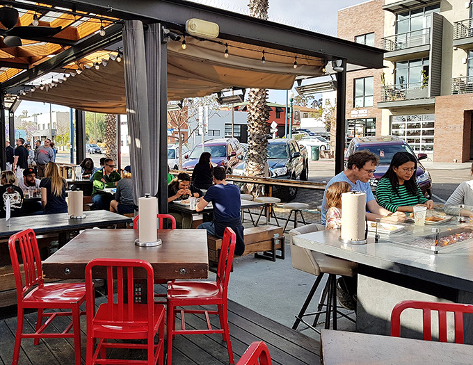Communal tables encourage strangers to become friends, united by the universal language of "have you tried the Firebird sandwich yet?"