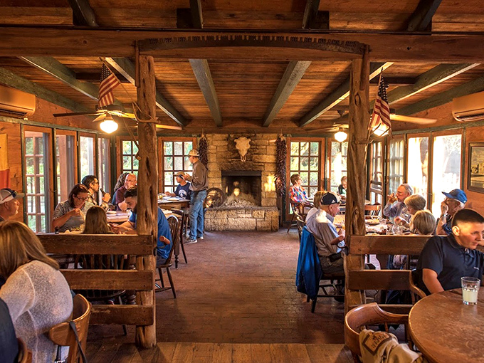 Where strangers become neighbors. The dining room's stone fireplace and wooden beams have witnessed more Texas tales than a rodeo announcer.