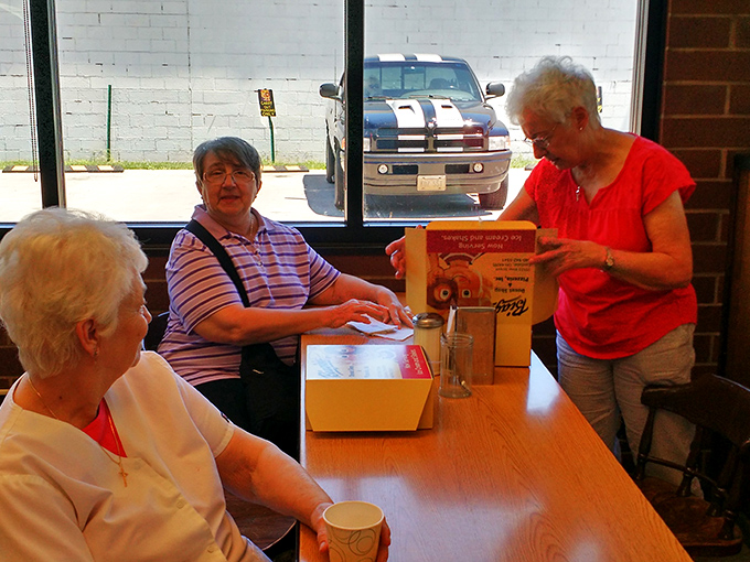 The morning gathering of the donut faithful. These ladies know that calories consumed with friends don't count.