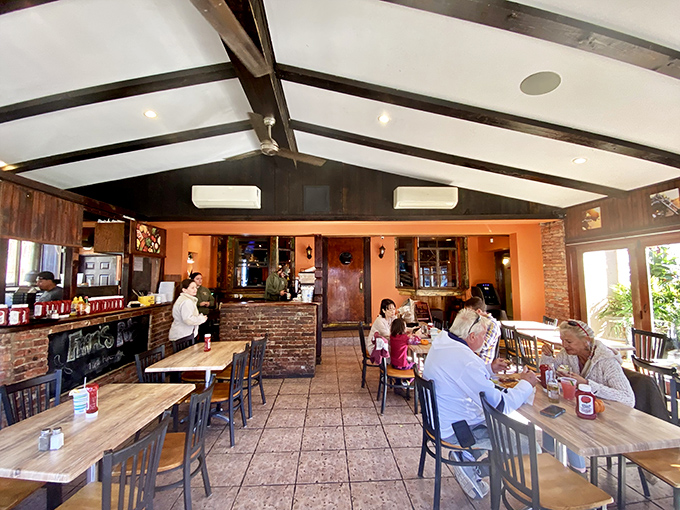 Vaulted ceilings and exposed beams create an airy escape where lunch feels like a mini-vacation from the world outside.