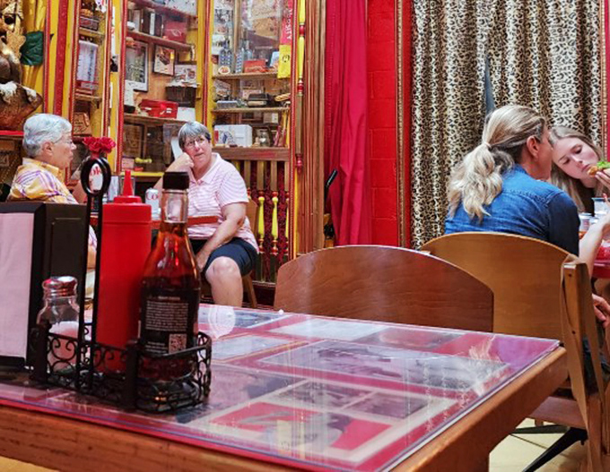 Diners enjoying their meals amid the quirky decor prove that O'Betty's isn't just a restaurant – it's a community gathering spot.