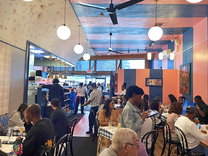 A bustling dining room where strangers become temporary breakfast companions, united by the universal language of "mmm" and "pass the hot sauce."