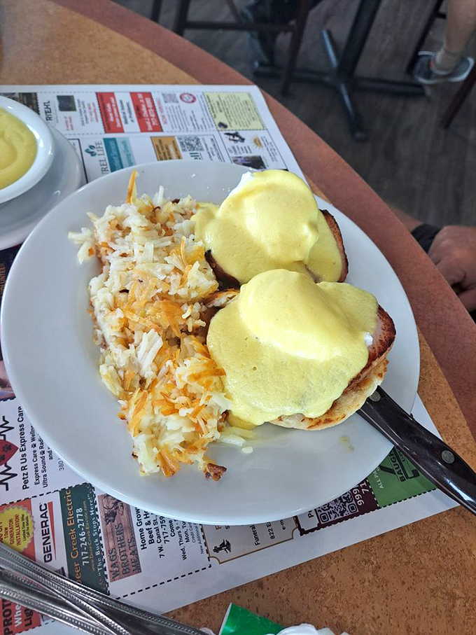Eggs Benedict that would make any brunch spot jealous, with hollandaise sauce cascading down like a yellow waterfall of happiness.