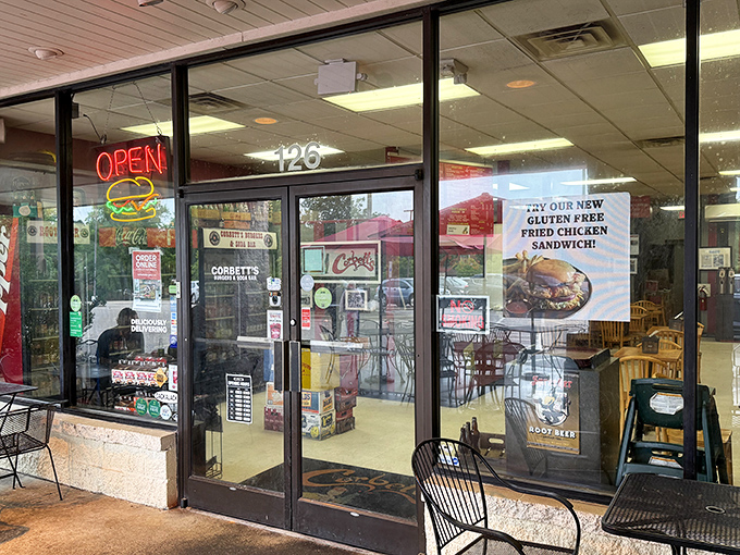 The neon burger sign glows like a beacon for the hungry. Your diet plan can wait until tomorrow.