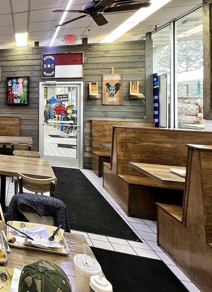 North Carolina pride on display. The state flag watches over diners as they worship at the altar of smoked meats.