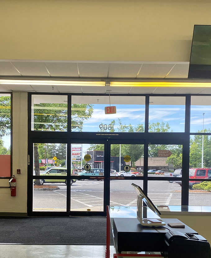 The exit sign&mdash;a gentle reminder that real life exists outside this bargain wonderland.