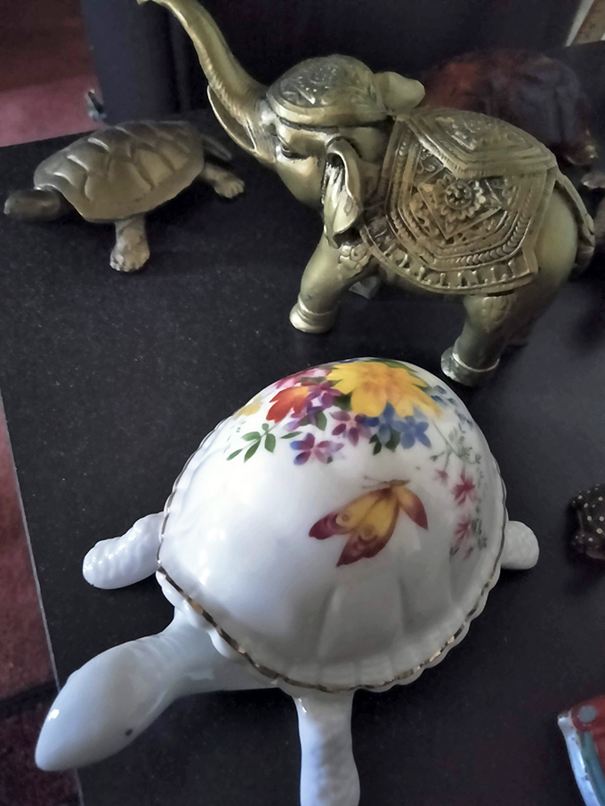These brass elephants and porcelain turtles once graced mantels and curio cabinets, silent witnesses to decades of family conversations. 