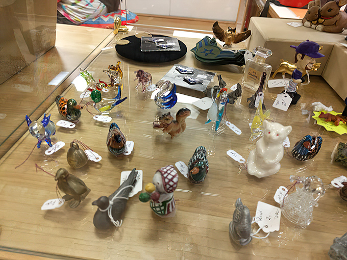 Tiny glass menagerie under lock and key&mdash;each miniature creature holds more value than its size would suggest.