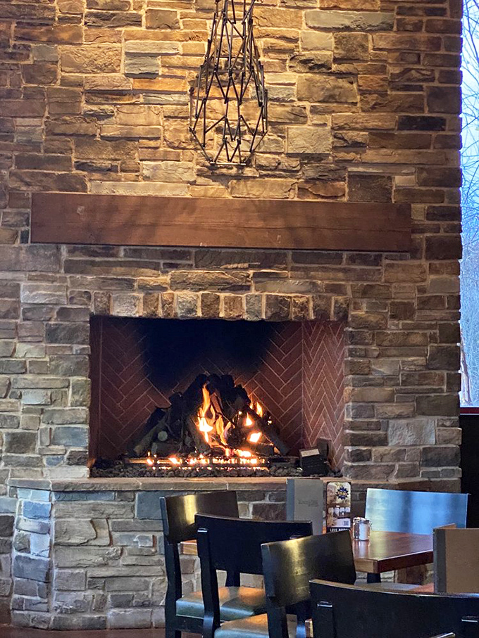 Stone, wood, and dancing flames create the mountain lodge fantasy. This fireplace begs you to linger longer over dessert and conversation.
