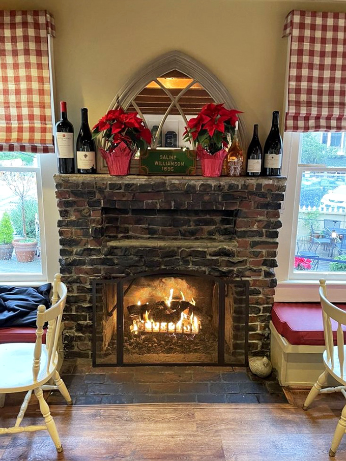 Nothing says "stay awhile" like a stone fireplace adorned with poinsettias and wine bottles&mdash;the heart of this converted home.