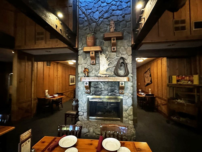 The stone fireplace stands as the restaurant's heart. Around it, countless stories have been shared over perfectly cooked ribeyes.