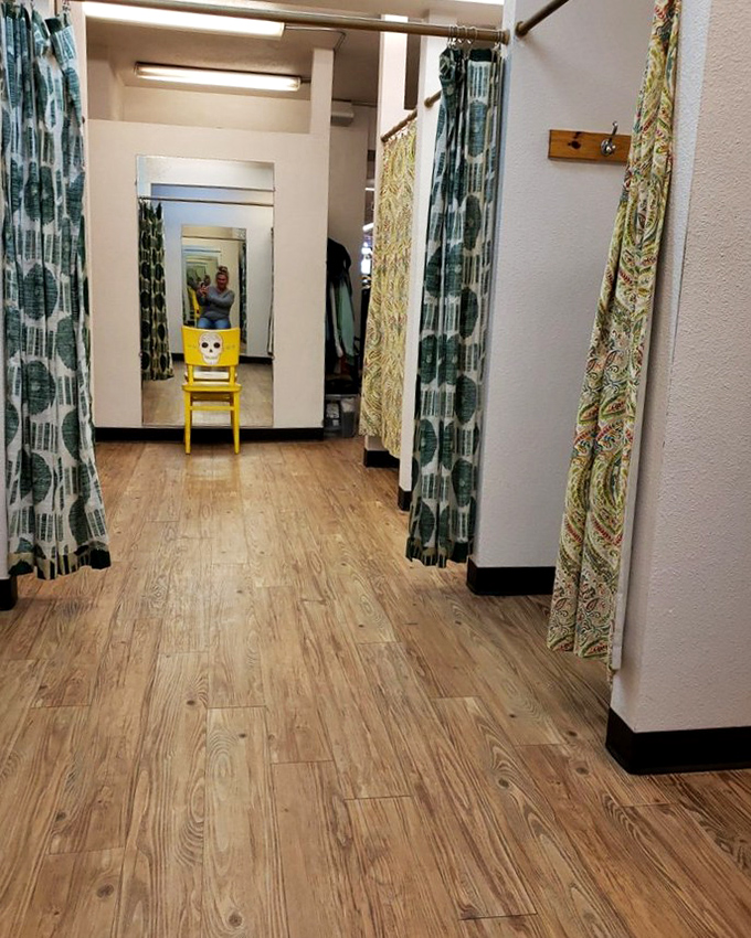 Fitting rooms adorned with patterned curtains&mdash;the final frontier between "maybe" and "definitely." That yellow chair has seen some questionable fashion choices.