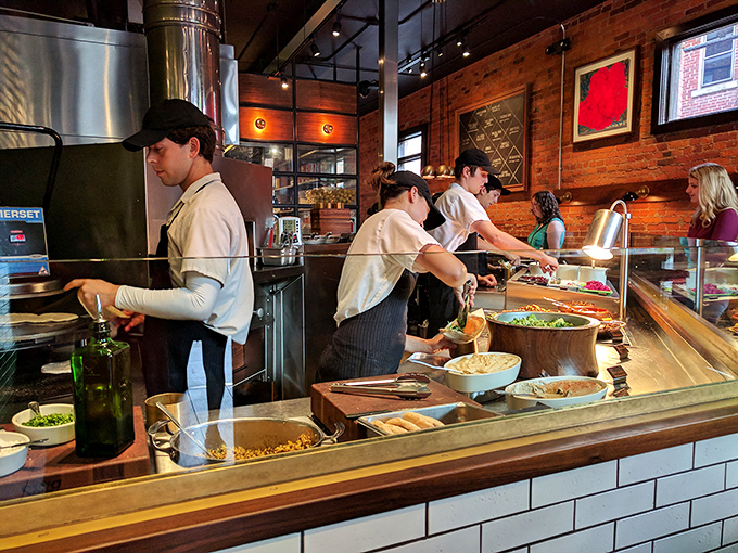 The assembly line of Mediterranean delights where dreams and pita meet. Each ingredient waits for its moment in the spotlight.