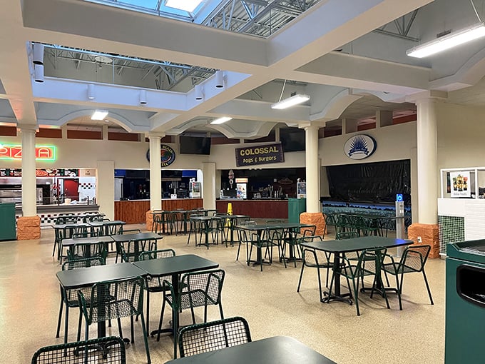 The food court offers a moment of respite for weary shoppers, where calories consumed are justified by calories burned walking between incredible deals.