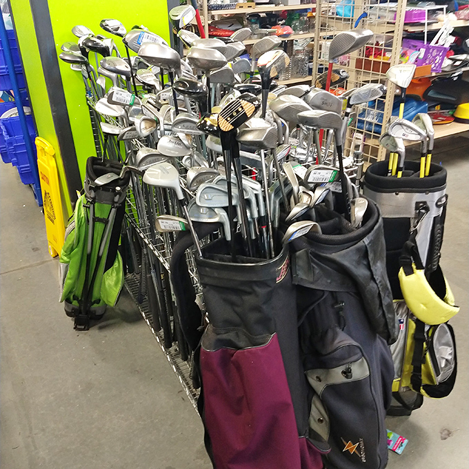 Golf club forest: where abandoned drivers and putters gather, silently judging each other's performance on previous fairways while awaiting their next chance.