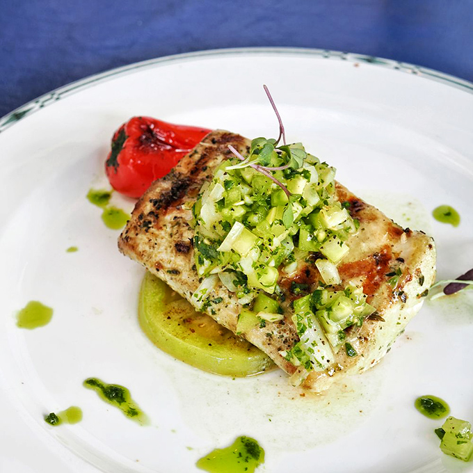Grilled mahi topped with fresh cucumber relish&mdash;proof that sometimes the simplest preparations let truly great seafood shine brightest.